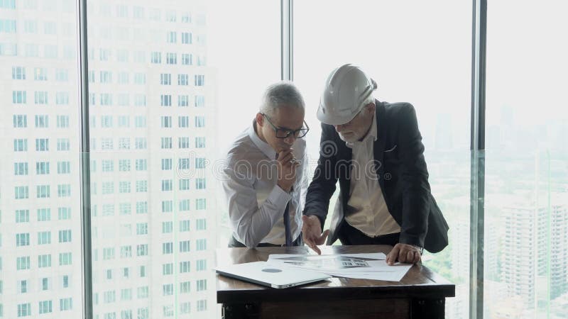 Two Man Engineer Discussing about Project and Planning Work is Teamwork ...