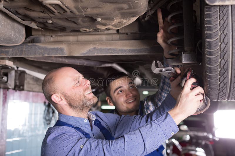 Two man fixing car stock image. Image of artificer, repairman - 50272133