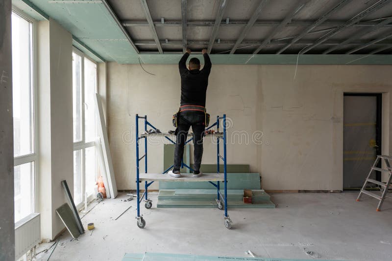 Two Man Help for Ceiling House Construction Stock Image - Image of ...