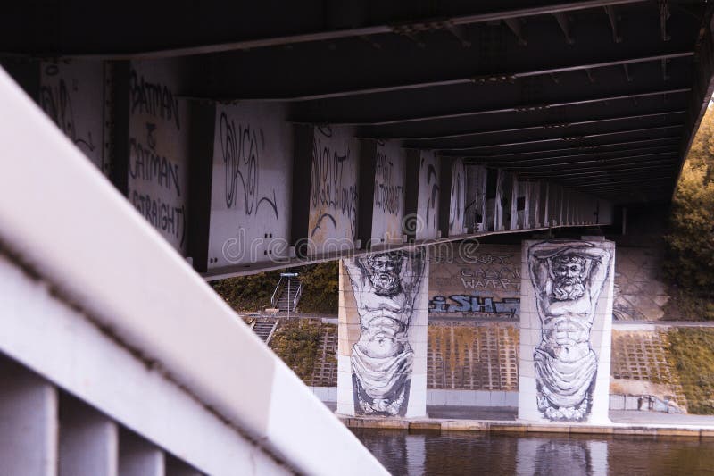 Two Man Holding Bridge Graffiti in Vilnius Stock Image - Image of wood ...