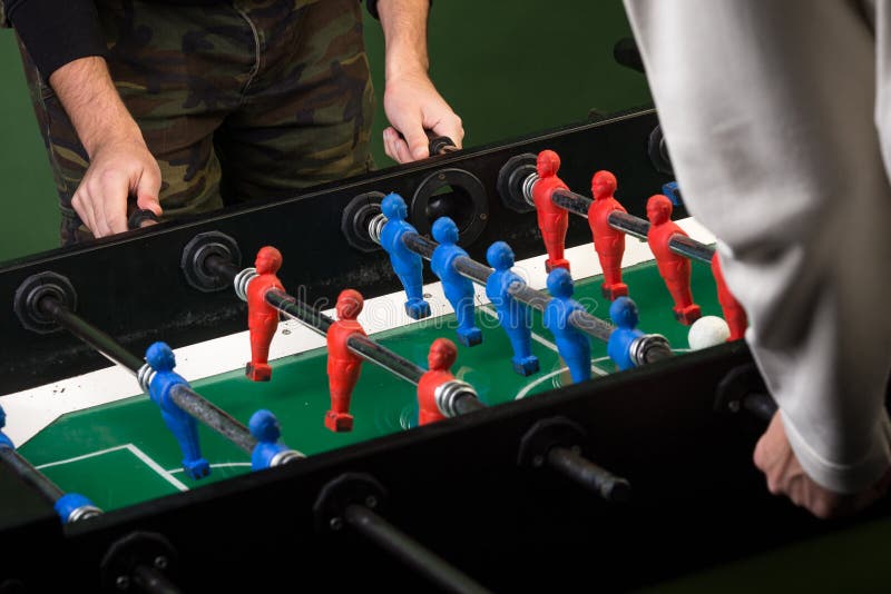 Two Man Playing Foosball Game Stock Image - Image of concentration ...