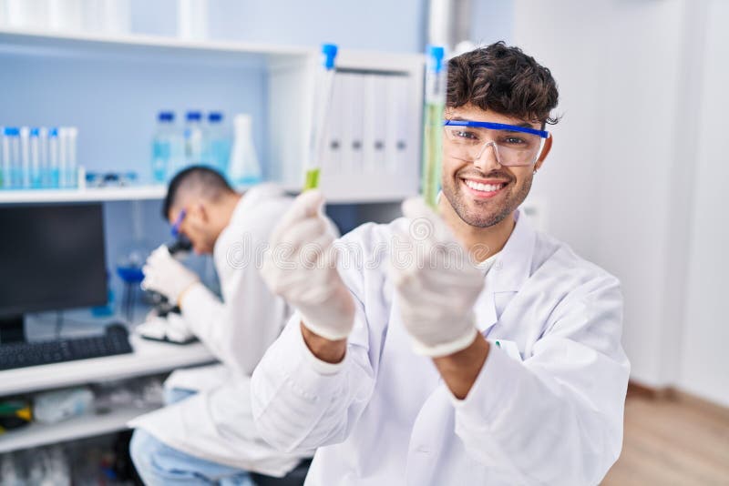 Two Man Scientists Holding Test Tubes Working at Laboratory Stock Photo ... Two Man Scientists Holding Test Tubes Working at Laboratory Stock Photo ...