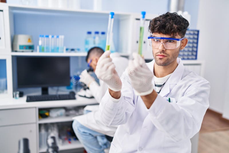 Two Man Scientists Holding Test Tubes Working at Laboratory Stock Image ... Two Man Scientists Holding Test Tubes Working at Laboratory Stock Image ...
