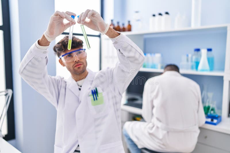 Two Man Scientists Holding Test Tubes Working at Laboratory Stock Image ...