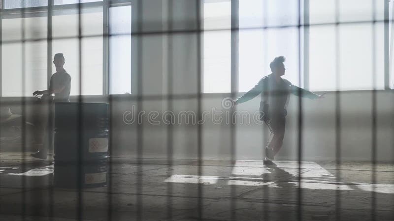 Two Man Street Dancing in Front of the Large Window in Abandoned ...