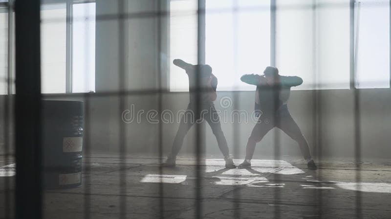Two Man Street Dancing in Front of the Large Window in Abandoned ...