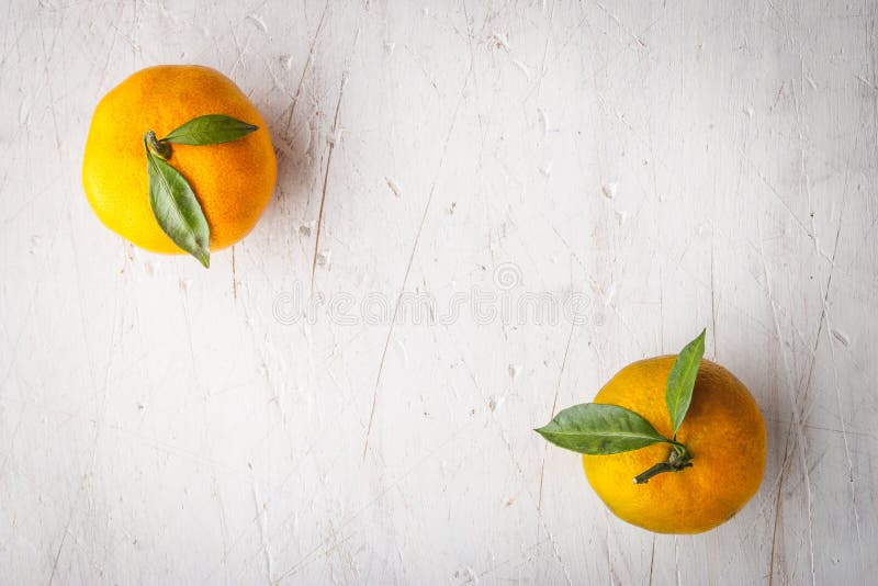 Two Mandarins on the White Wooden Table Top View Stock Photo - Image of ...