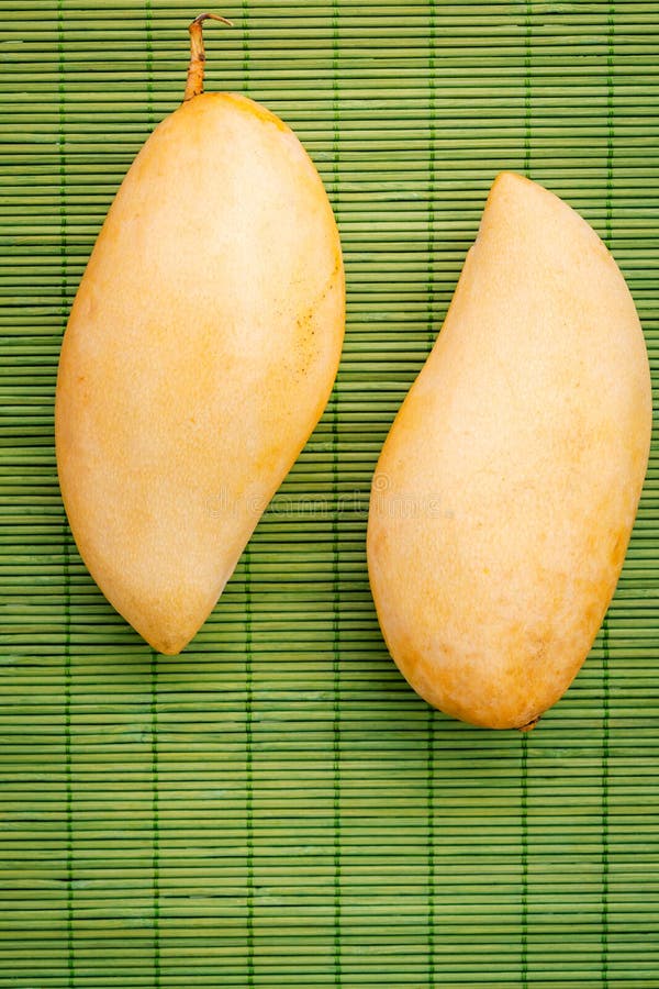 Two mango on bamboo stock image. Image of healthy, thai - 69076639