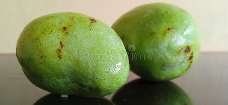Two mango on the table stock image. Image of fruit, tropical - 262902823