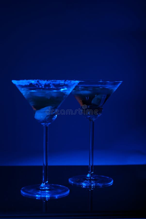 Two Martini Glasses with Blue Light Stock Photo - Image of glass, drink ...