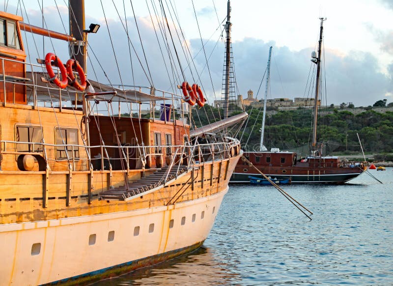 A Two Masted Sailing Ship Lies at Anchor in the Harbour at Sliema in ...