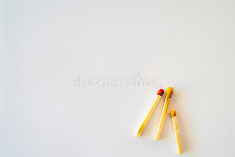 Two Matches are Laying Next To Each Other on a White Surface Stock ...