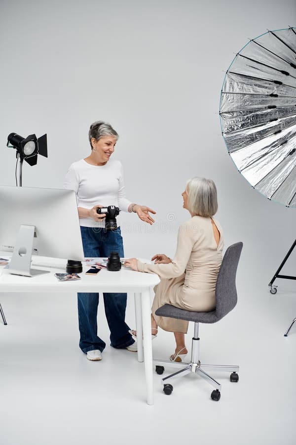Two Mature Women, a Photographer and Stock Image - Image of creative ...