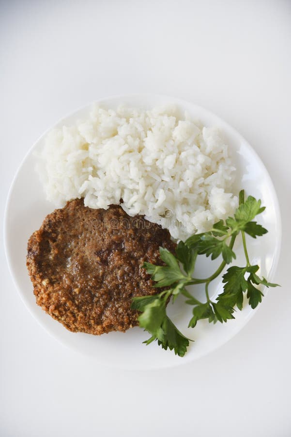 Two Meat Cutlets with Rice on a White Plate. Meat Breakfast with Rice ...