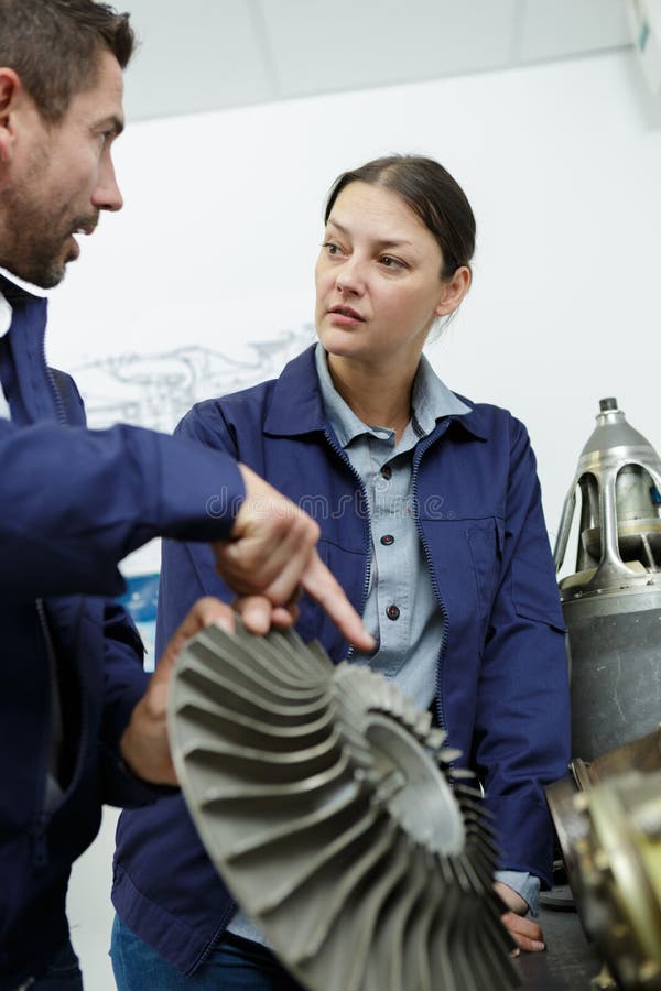 Two Mechanics Holding Mechanical Parts Stock Photo - Image of disk ...