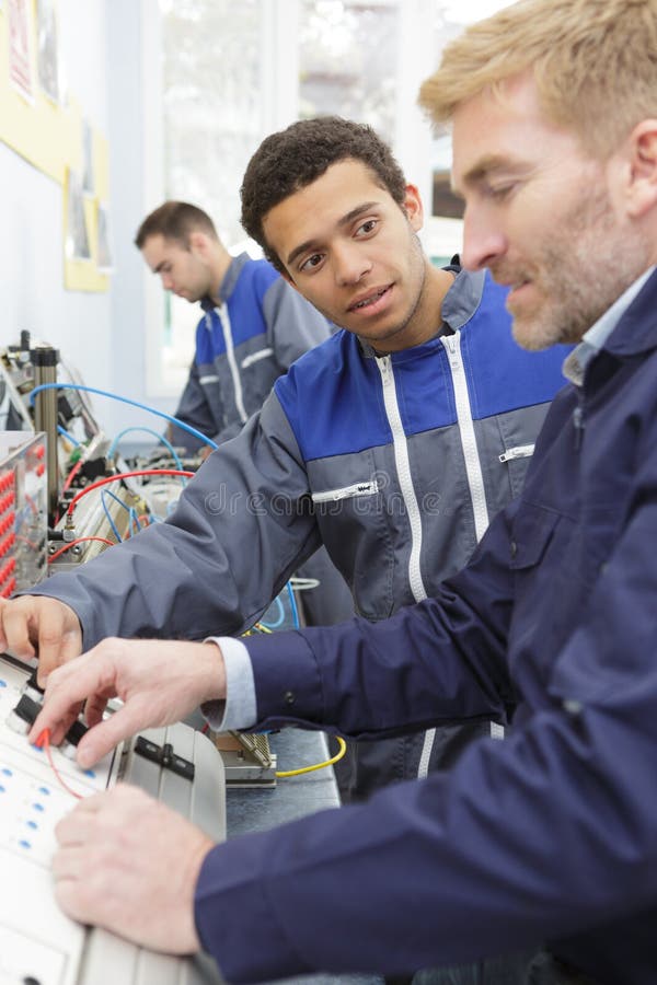 Two Mechanics Testing Car Battery Stock Image - Image of person ...