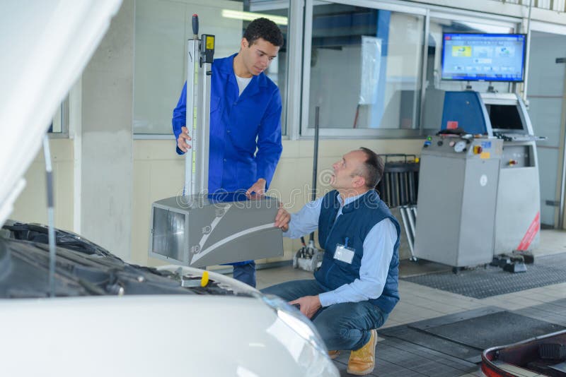 Two Mechanics Working on Car Stock Image - Image of wrench, workshop ...