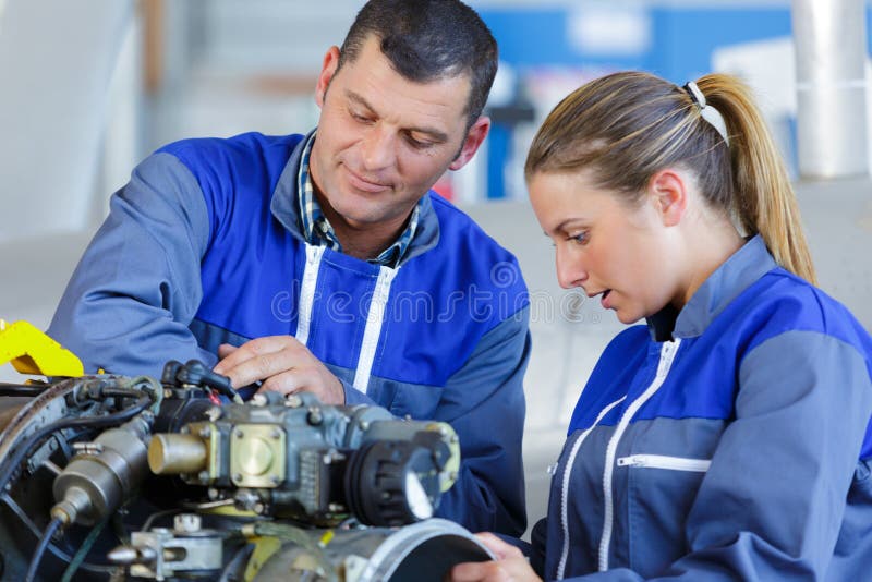 Two Mechanics Working in Workshop Stock Photo - Image of teamwork ...