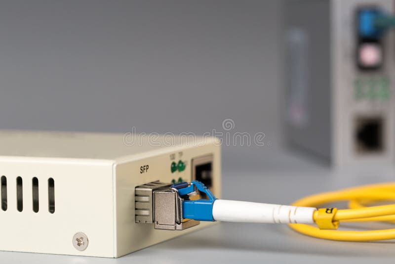Media Converters. Fiber Optic Cables Connected To an Optic Ports and ...