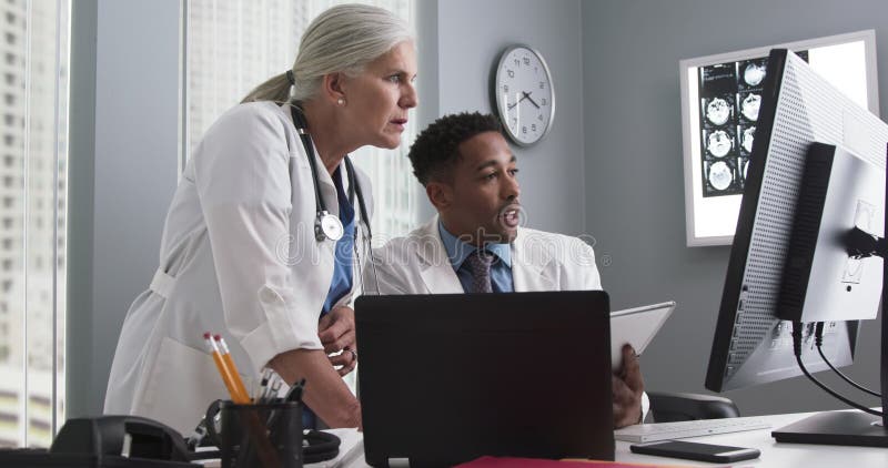 Two Medical Doctors Working Inside Office Using Technology Stock Video ...