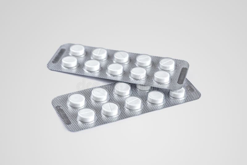Two Medical Packages with White Tablets on a White Background Stock ...