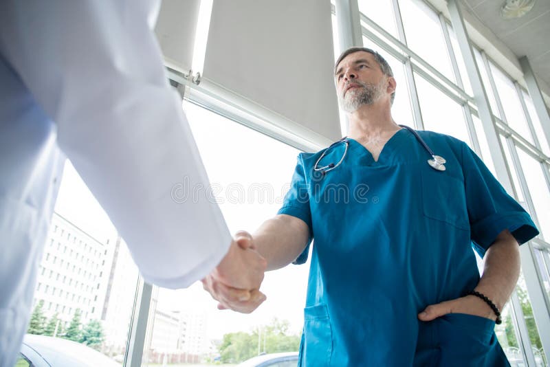 Two Medical People Handshaking at Office, in Hospital. Stock Photo ...