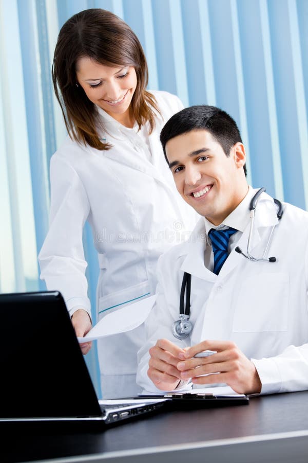 Two Medical People at Office Stock Image - Image of people, document ...