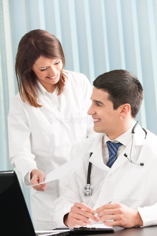 Two medical people working stock photo. Image of person - 8481824
