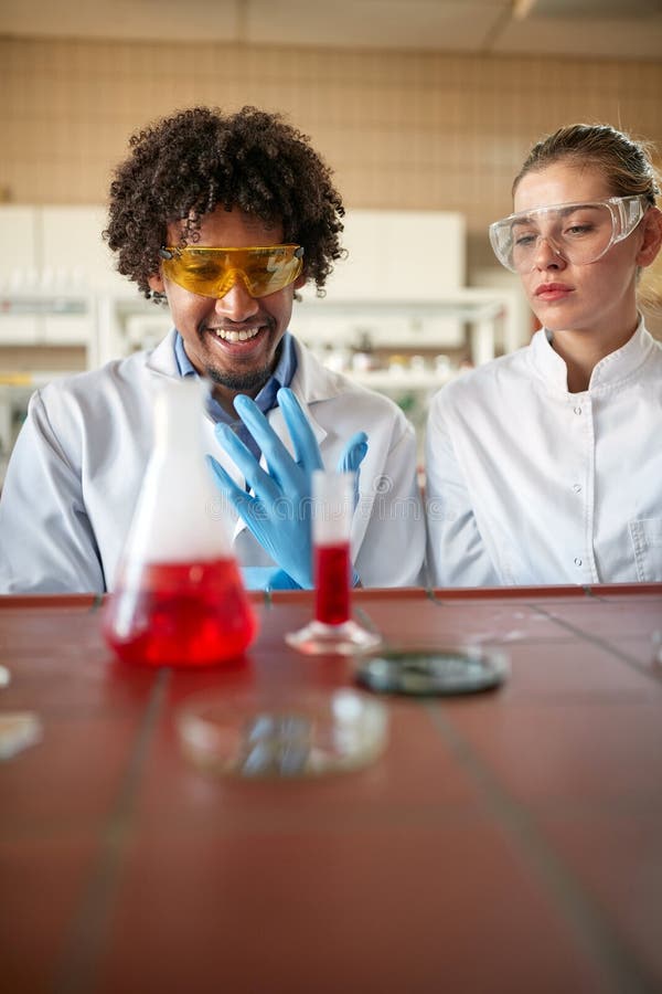 Two Medical Students Conducting Chemical Experiment Stock Photo - Image ...