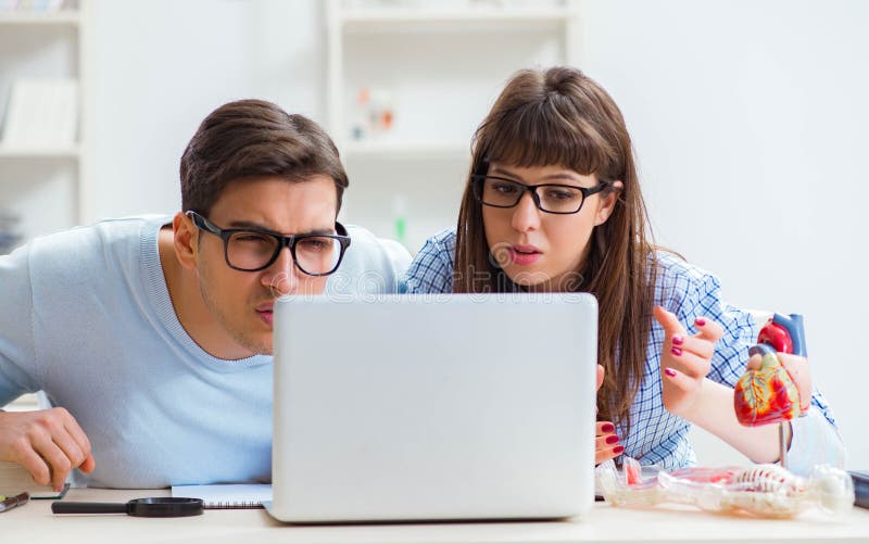 Two Medical Students Studying in Classroom Stock Image - Image of ...