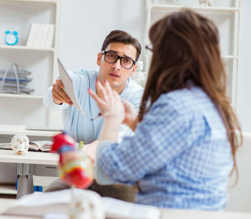 Two Medical Students Studying in Classroom Stock Photo - Image of ...