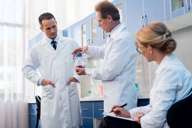 Scientists Making Experiment Stock Image - Image of people, sample ...