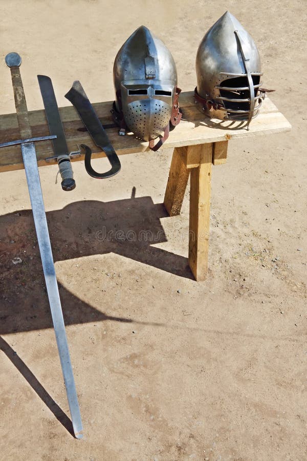 Two Medieval Helmet Big Sword and Two Small Sword Stock Image - Image ...