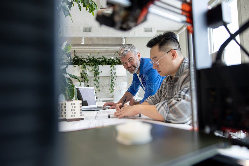 Two Men Architects Using 3D Printer in Office and Projecting House ...