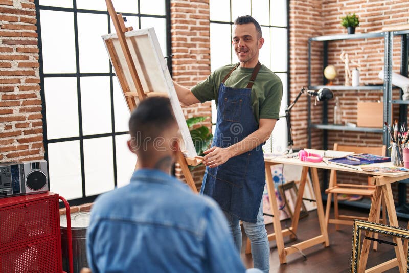 Two Men Artists Smiling Confident Drawing Portrait at Art Studio Stock ...