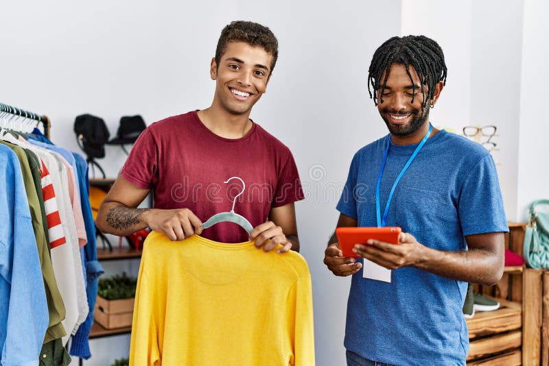 Two Men Asking Shopkeeper for Clothes Size Using Touchpad at Clothing ...