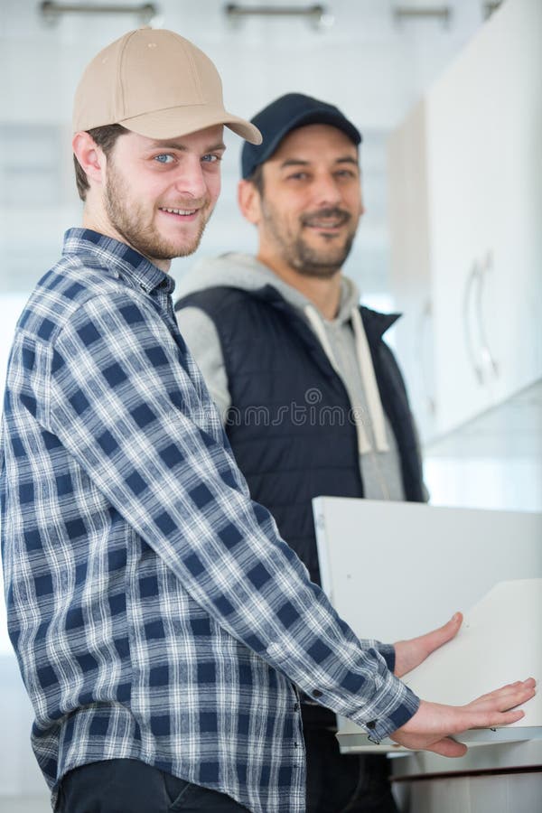 Two Men Assembling Kitchen Furniture Stock Image - Image of improvement ...