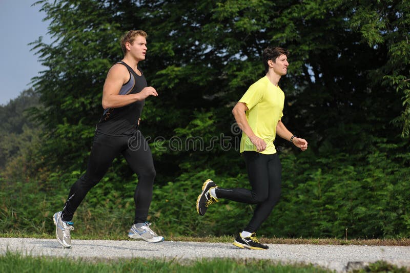 Two Men Athletes Running / Jogging Stock Photo - Image of exercising ...