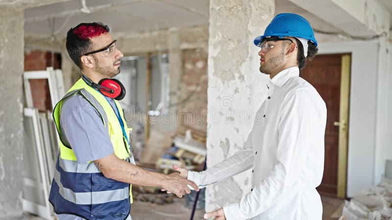 Two Men Builder and Architect Shake Hands with Relaxed Expression at ...