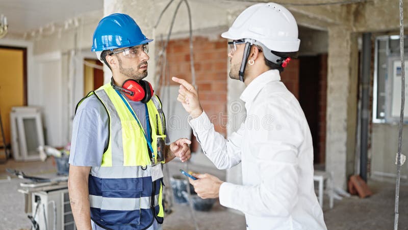 Two Men Builder and Architect Standing Together Speaking at ...