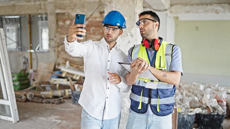Two Men Builders and Architect Having Video Call Writing on Document at ...