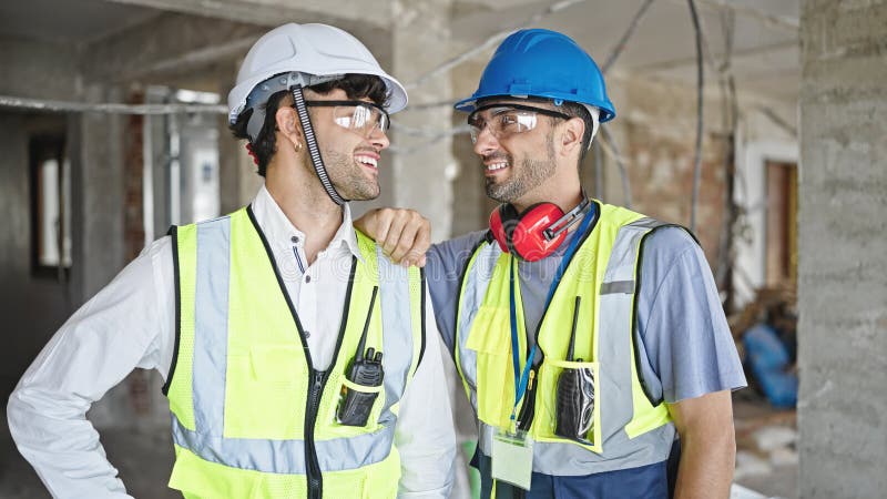Two Men Builders Smiling Confident Standing at Construction Site Stock ...