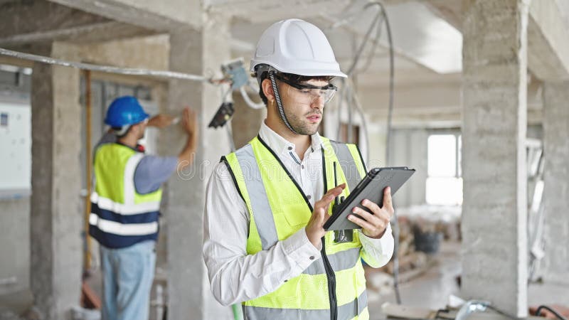 Two Men Builders Using Touchpad at Construction Site Stock Photo ...