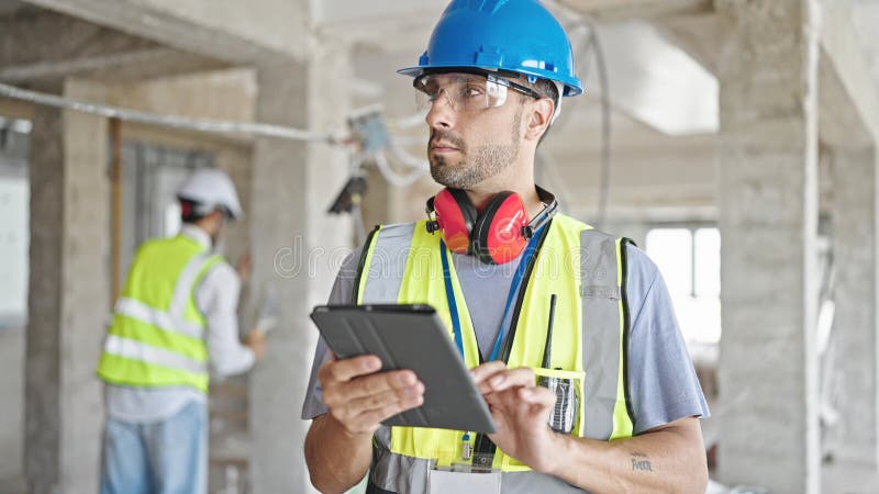 Two Men Builders Using Touchpad at Construction Site Stock Image ...