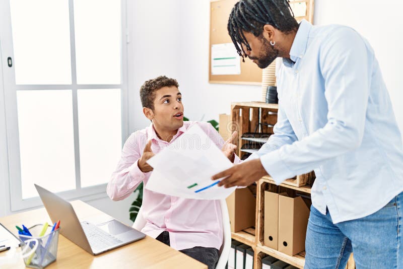 Two Men Business Workers Discussing Working at Office Stock Photo ...