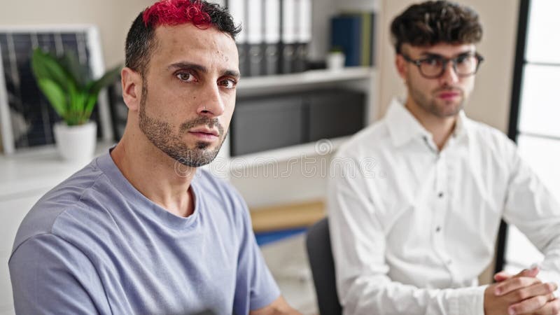 Two Men Business Workers Sitting on Table with Relaxed Expression at ...