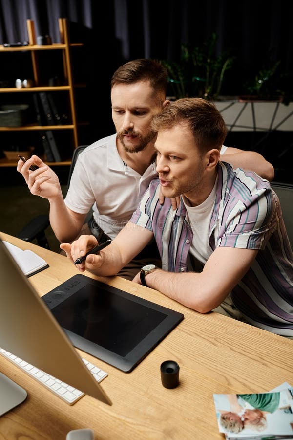 Creative Collaboration: Two Men Engrossed Stock Photo - Image of ...