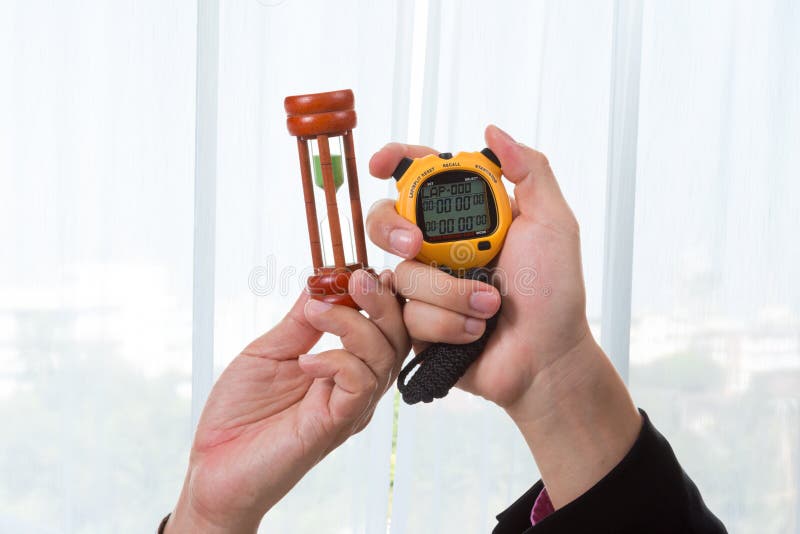 Two Men Checking Timer by Hourglass or Stop Watch Stock Photo - Image ...