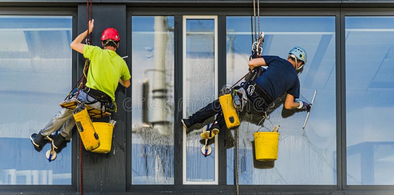 Man Cleaning Windows and Wall on Old City Bulding Editorial Image ...