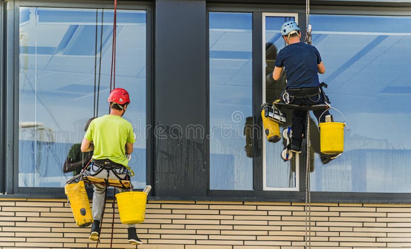 Two Men Cleaning Windows on an Office Building Editorial Photography ...